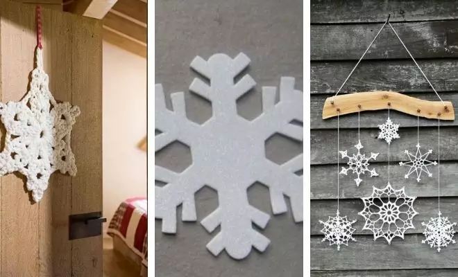 Kalėdomis puoštos durys su sniego žvaigždėmis